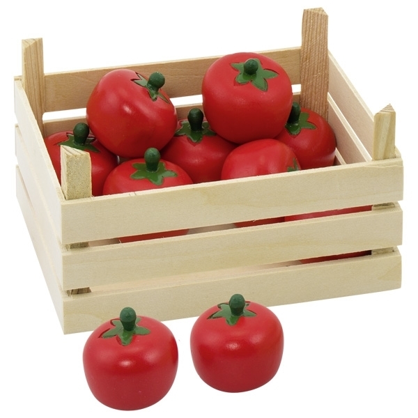 Story box toys and books. Tomatoes in vegetable crate